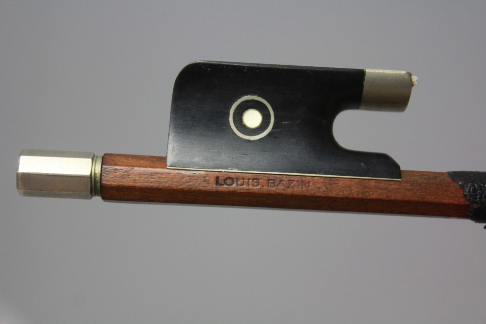 A nickel mounted French violin bow of the Bazin school stamped Louis ...