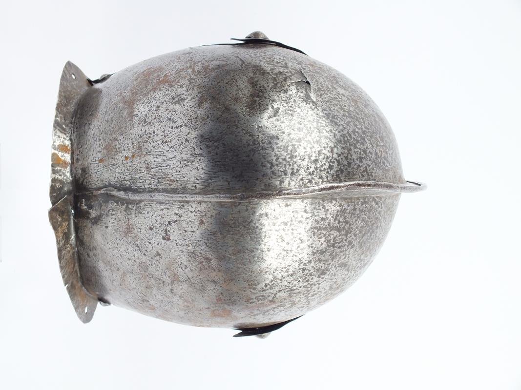 An Italian close-helmet of Savoyard form, the two-piece skull with ...