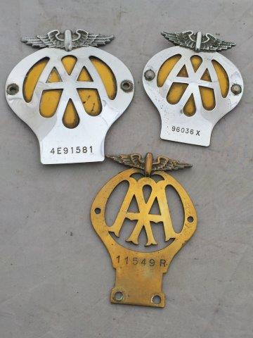 A small early brass AA car badge, no. 11549R, a small motorcycle AA ...