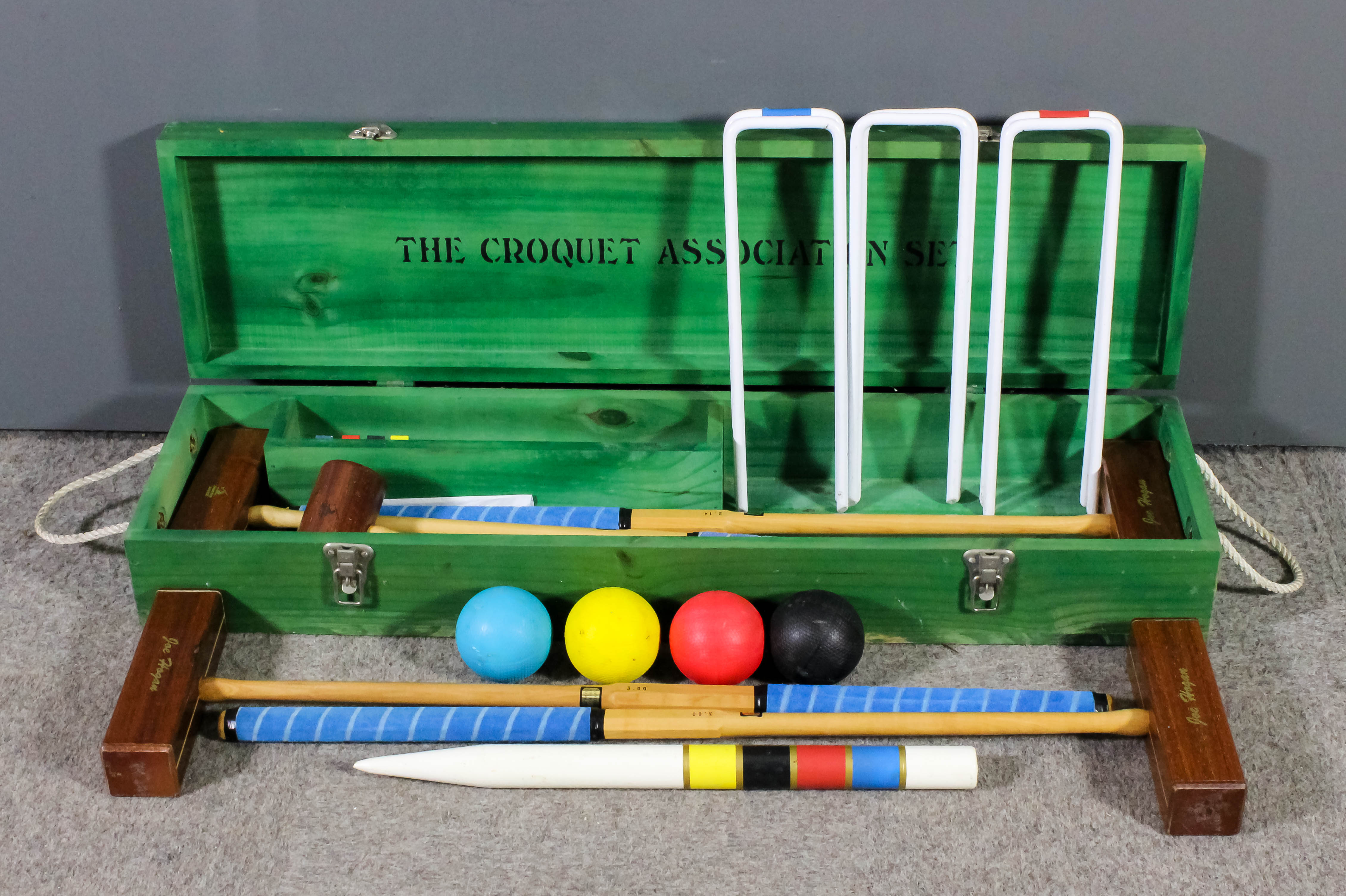 A "Croquet Association" Croquet set, contained in green painted box, 41 ...