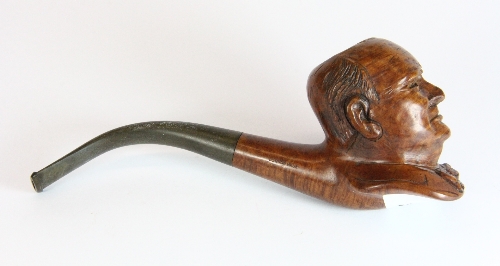 A carved right handed wooden pipe of Sir Winston Churchill