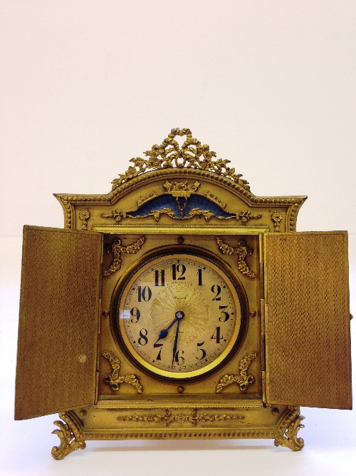 An early 20th century 8 day brass framed bedside clock by Finnegans ...