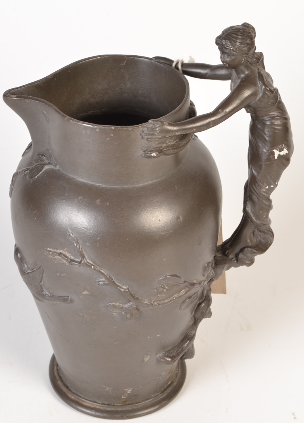 A French pewter jug with female figure handle, marked Etain Garanti Pur ...