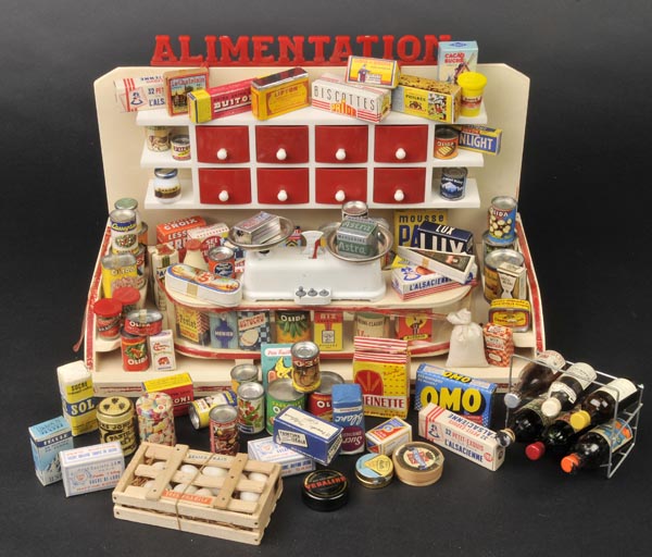 *Miniature Shop. A French toy grocer's shop, 1950s, hardboard and ...