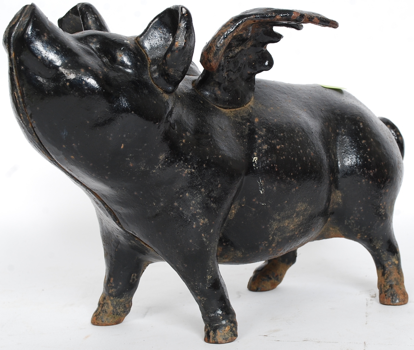 A vintage style cast iron flying pig money box in the form of a smiling ...