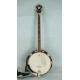 A four-string banjo with 'Remo Weather King' banjo head, 95cm overall ...