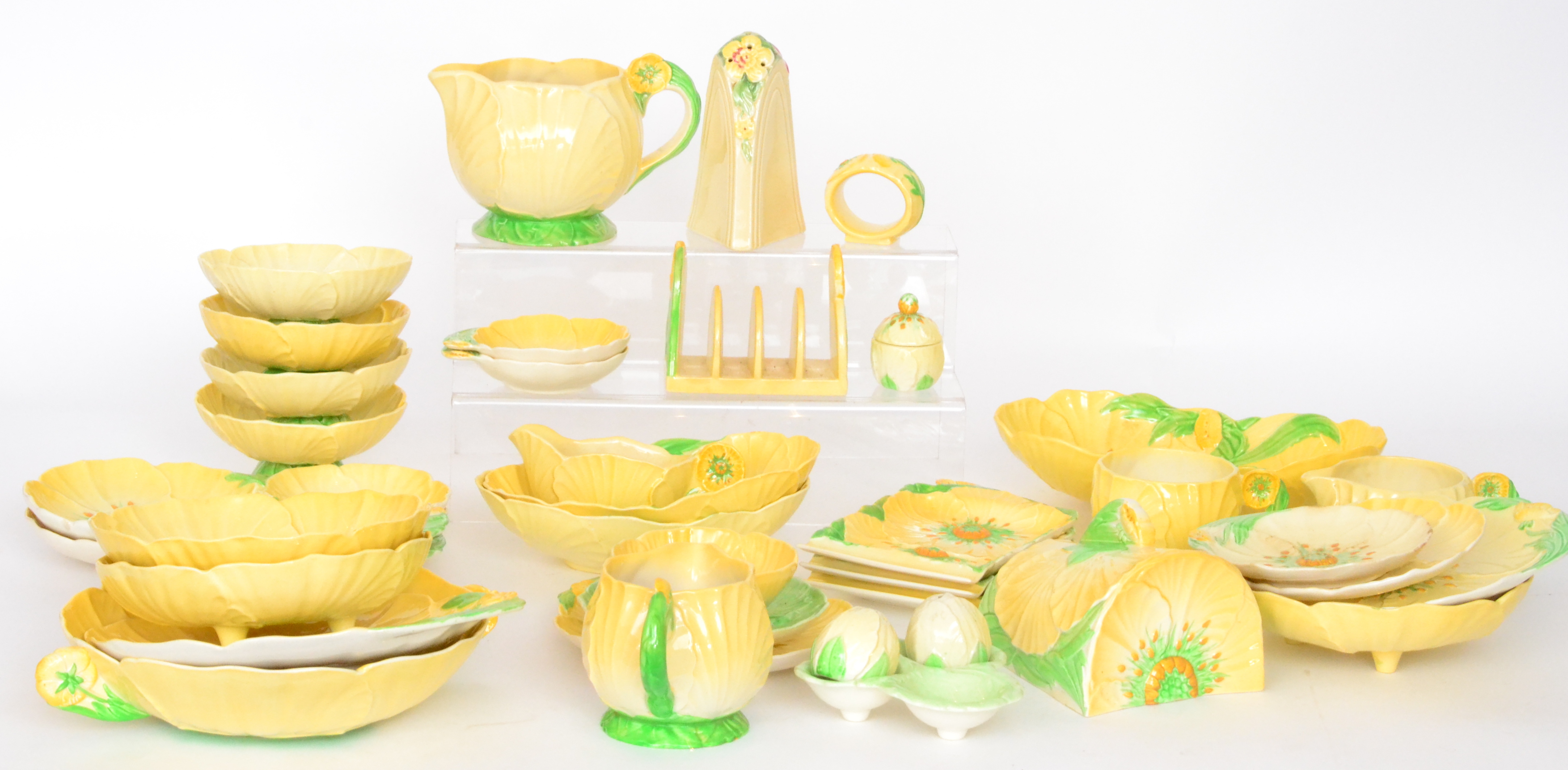 A collection of assorted embossed Carlton Ware decorated with yellow ...