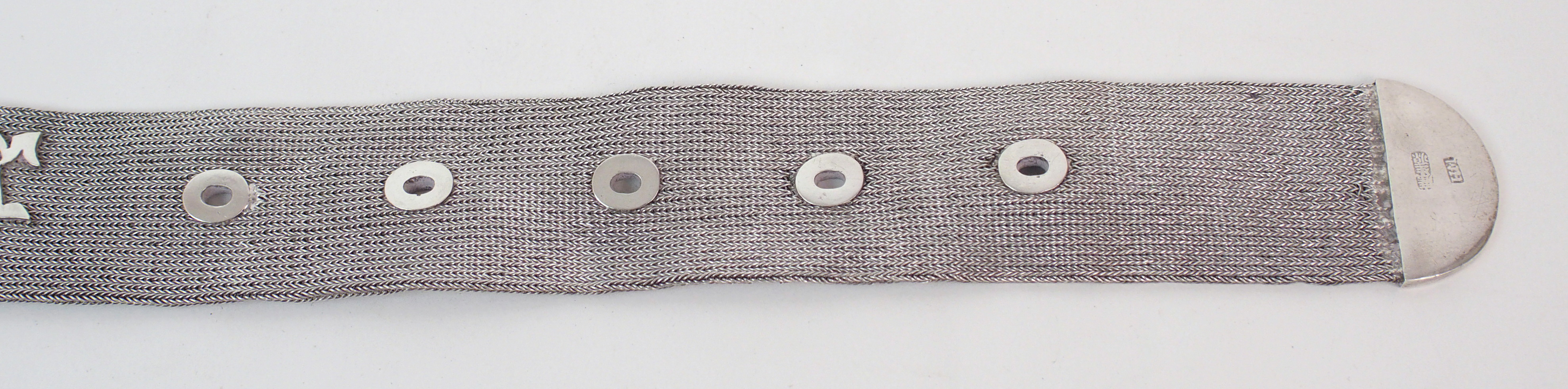 A Chinese silver mesh belt applied with shou characters, the buckle ...