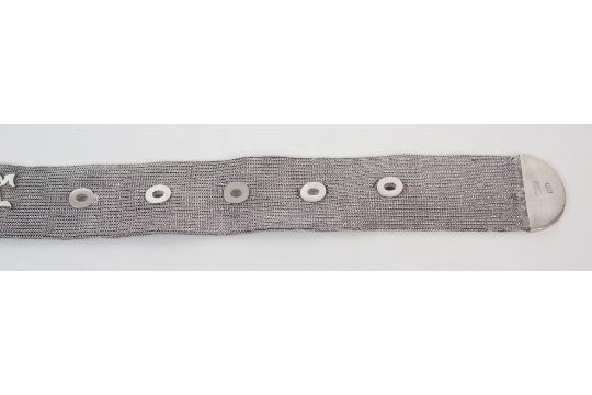 A Chinese silver mesh belt applied with shou characters, the buckle ...