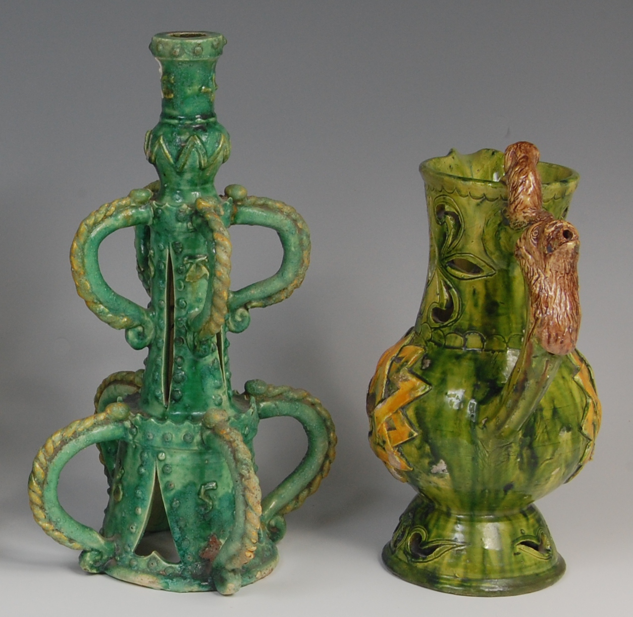 An Edward Bingham Castle Hedingham Pottery Puzzle jug, decorated in ...