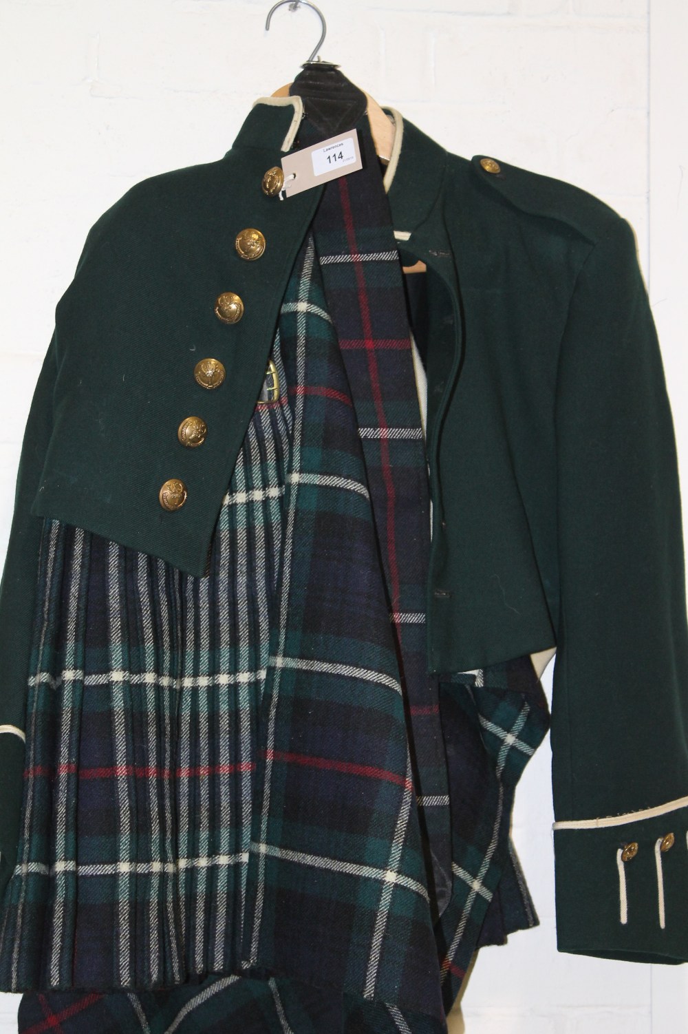 A SEAFORTH HIGHLANDER PIPERS TUNIC & KILT etc A green coatee with ...