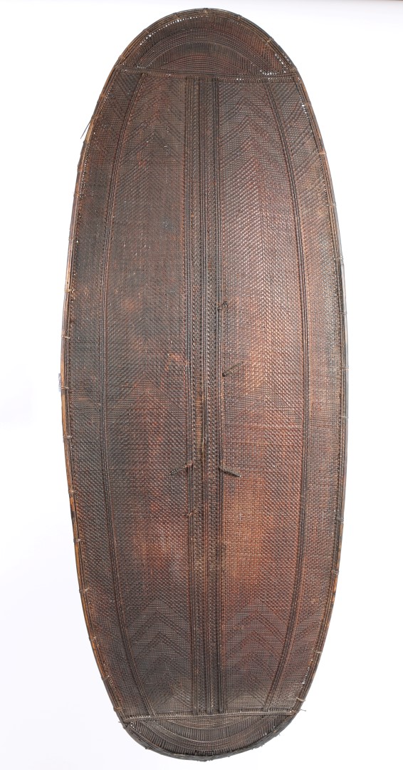AN AFRICAN, CONGOLESE, BASKET WORK SHIELD with geometric decoration and ...