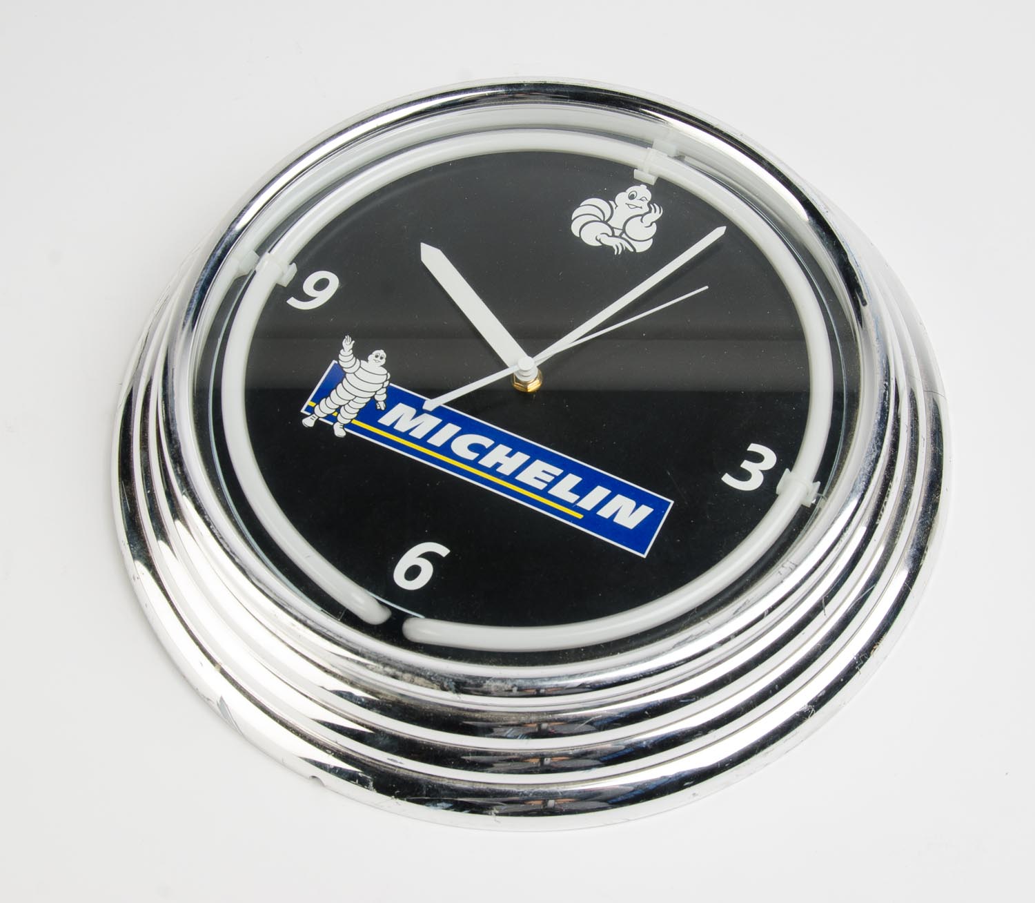 MICHELIN: A neon blue Michelin wall clock 38cm diameter together with a ...