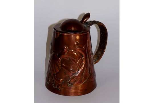 A Newlyn copper lidded jug with hammer textured domed cover and thumb ...