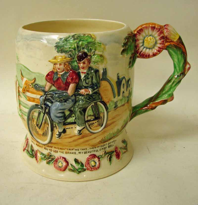 A Crown Devon musical tankard, Daisy Bell, decorated with cyclists ...