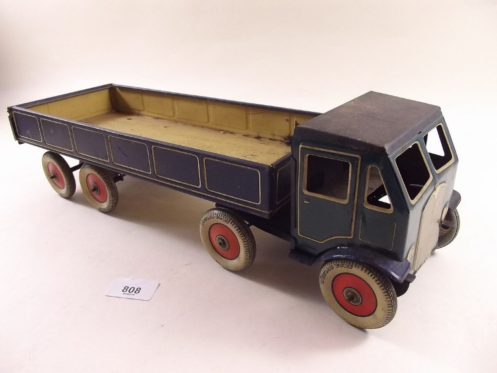 A Mettoy tin plate clockwork articulated lorry, the tyres marked ...