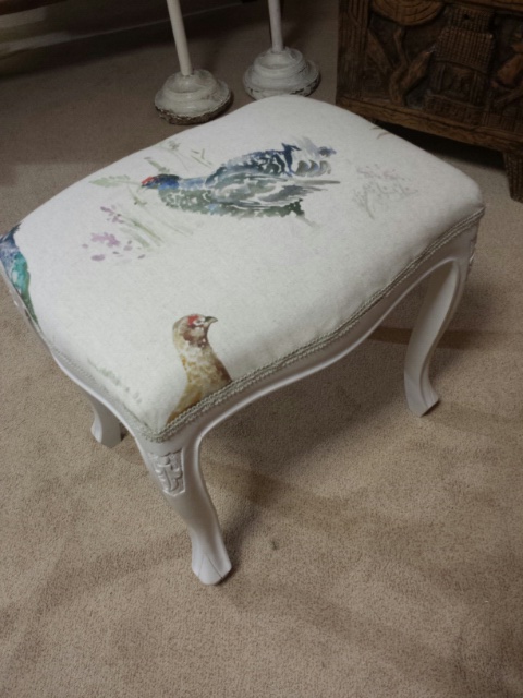 Upholstered white stool using "Voyage" handprinted pheasant fabric