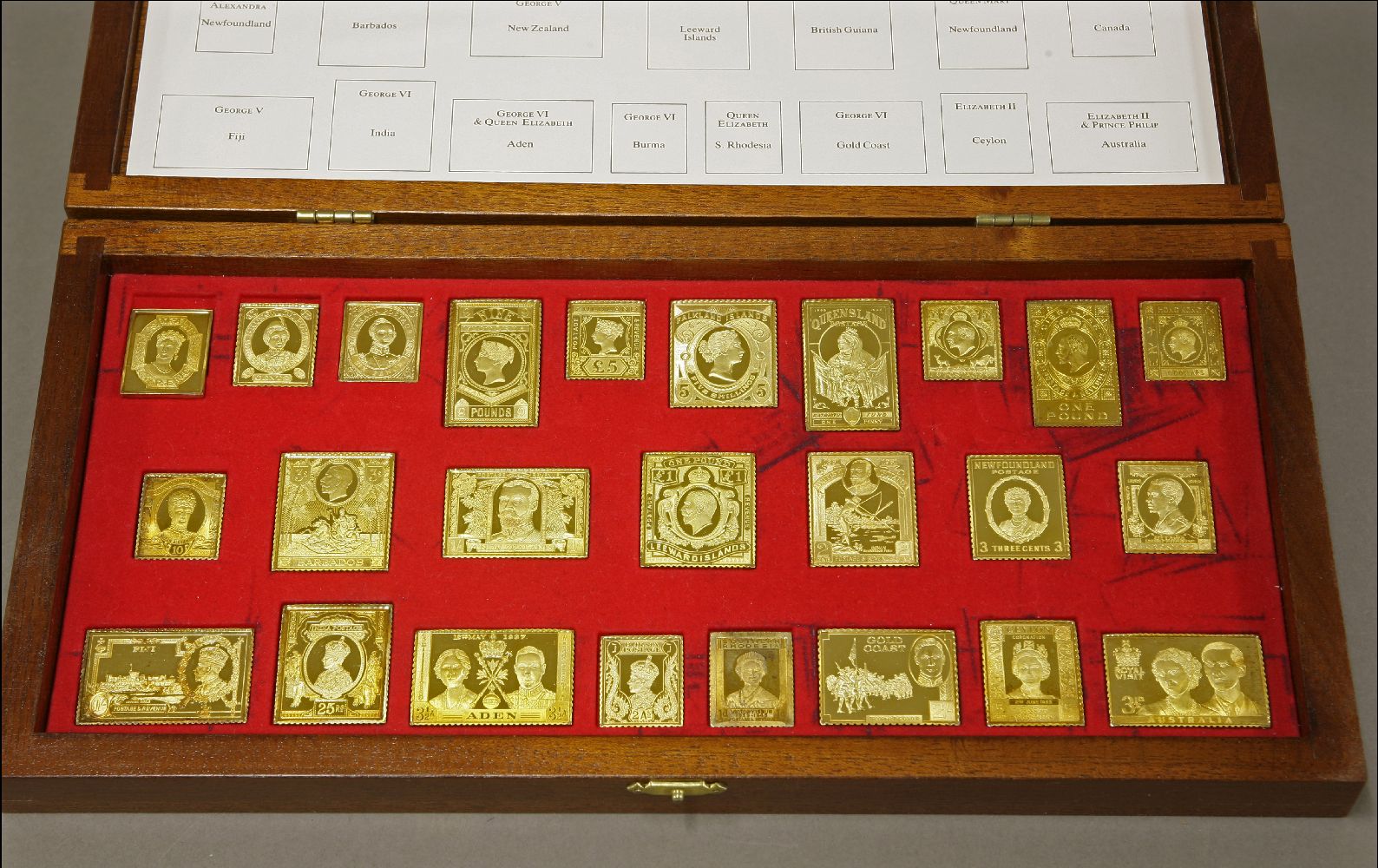 A Danbury Mint Royal Stamps of the Empire silver ingots, together with ...