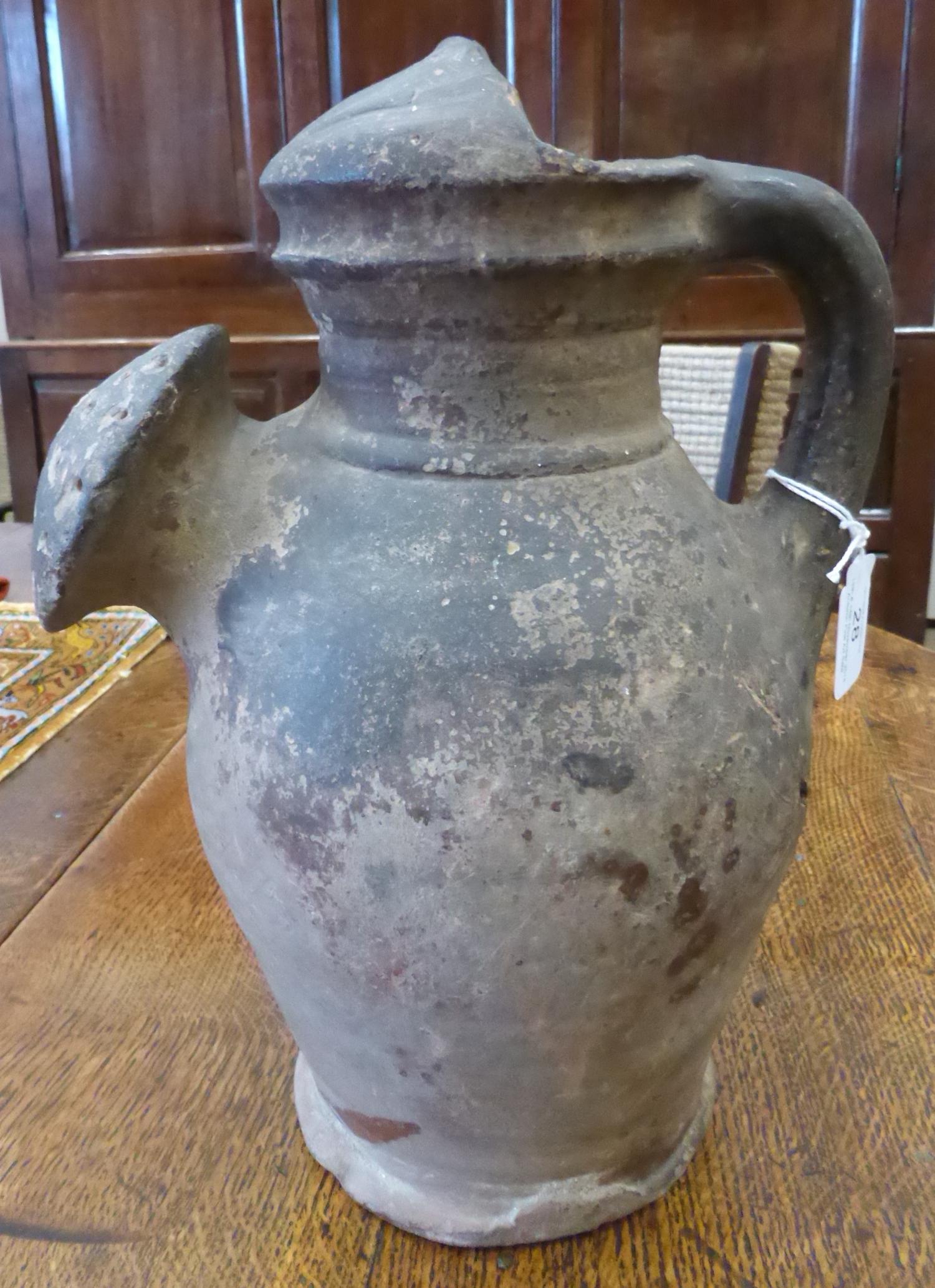 A Terracotta Watering Can, 16th century, of baluster form with pierced ...