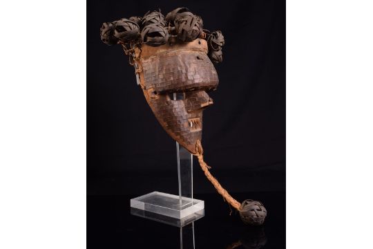 A Salampasu mask, D.R.Congo, with woven ball coiffure, the face with ...