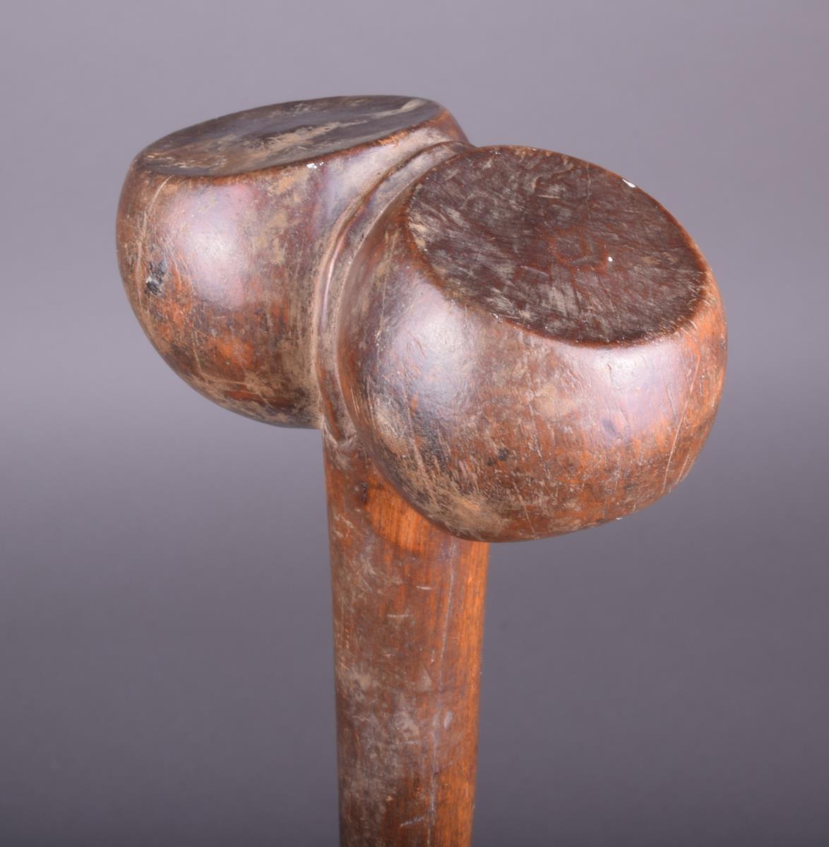 A South African knobkerrie, the shaft with a reeded band and a twin ...