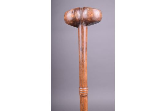 A South African knobkerrie, the shaft with a reeded band and a twin ...
