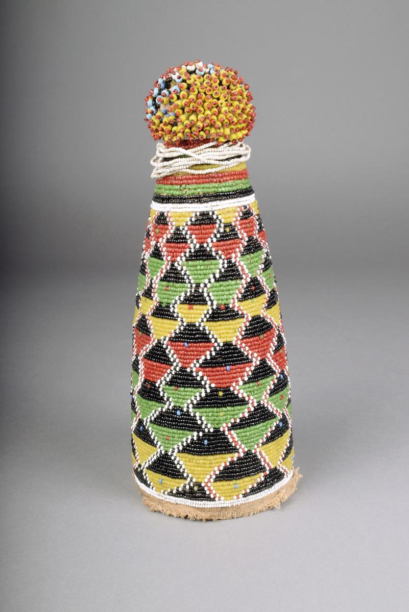 A Sotho beadwork doll, South Africa, with a wooden core and cloth ...