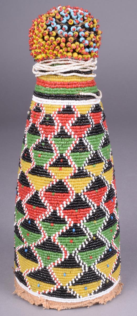 A Sotho beadwork doll, South Africa, with a wooden core and cloth ...