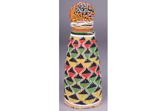 A Sotho beadwork doll, South Africa, with a wooden core and cloth ...