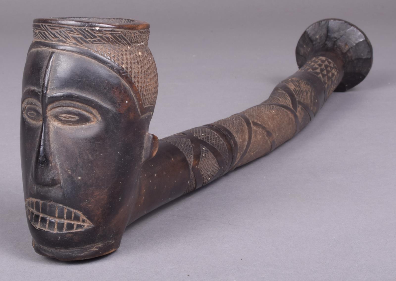 A Kuba pipe, D.R.Congo, carved wood in three sections with a head bowl ...
