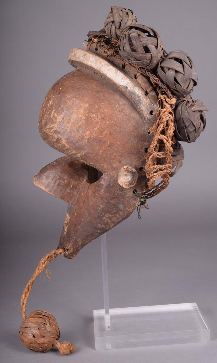 A Salampasu mask, D.R. Congo, with pigment finish, fibre headdress with ...
