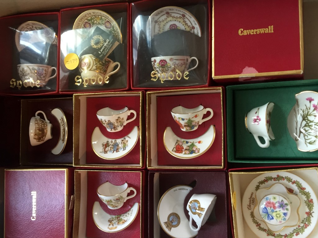 A large collection of miniature cups and saucers to include examples by ...
