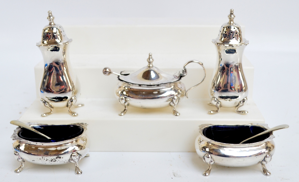 A George V hallmarked silver five piece cruet set comprising a pair of ...