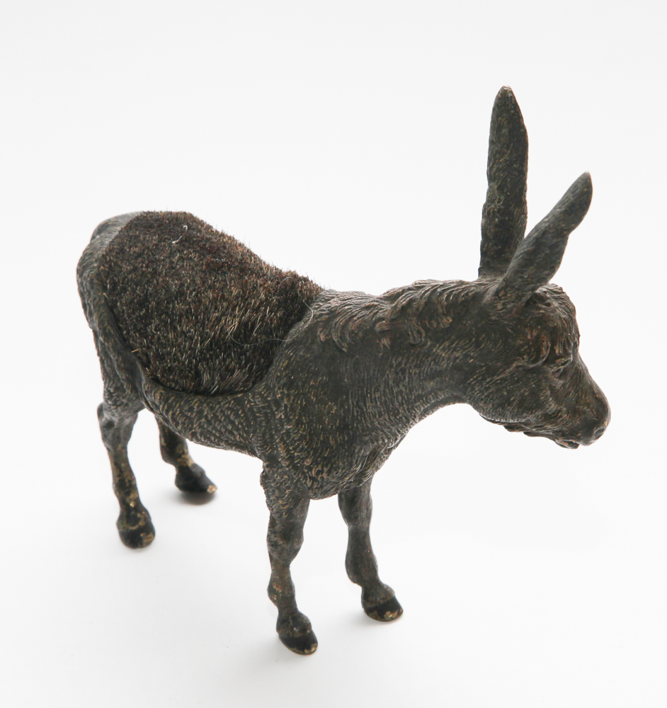 Late Victorian bronze pen wipe modelled as a donkey, the back inset ...
