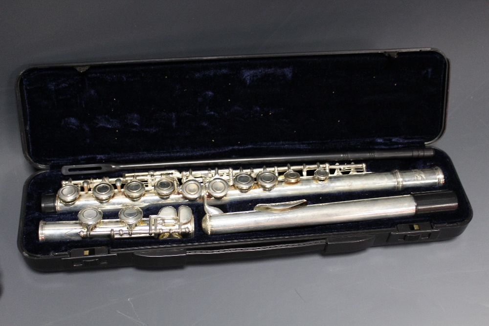A VINTAGE CLARINET WITH NICKEL FITTINGS, together with a modern plated ...