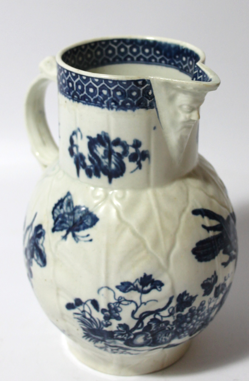 A late 18thC Caughley porcelain cabbage leaf jug, with satyr mask head ...
