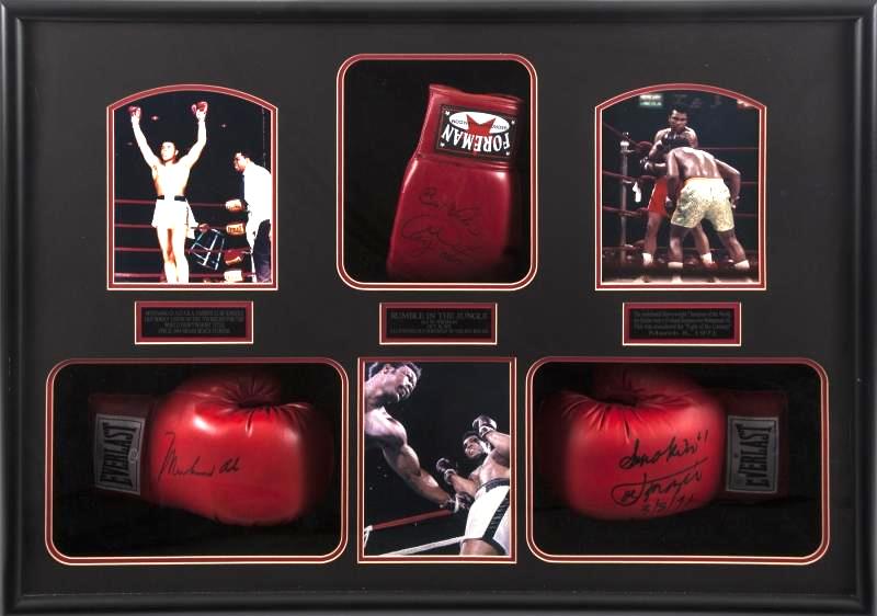 A shadowbox display featuring boxing gloves signed by Muhammad Ali ...