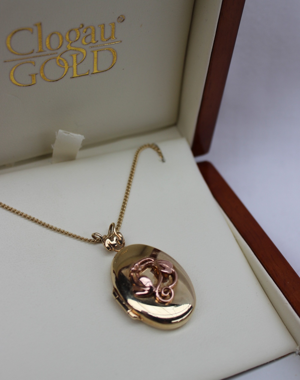A 9ct Clogau gold locket with a tree of life motif, on a yellow gold ...