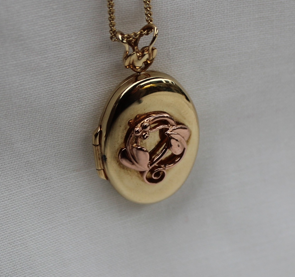 A 9ct Clogau gold locket with a tree of life motif, on a yellow gold ...