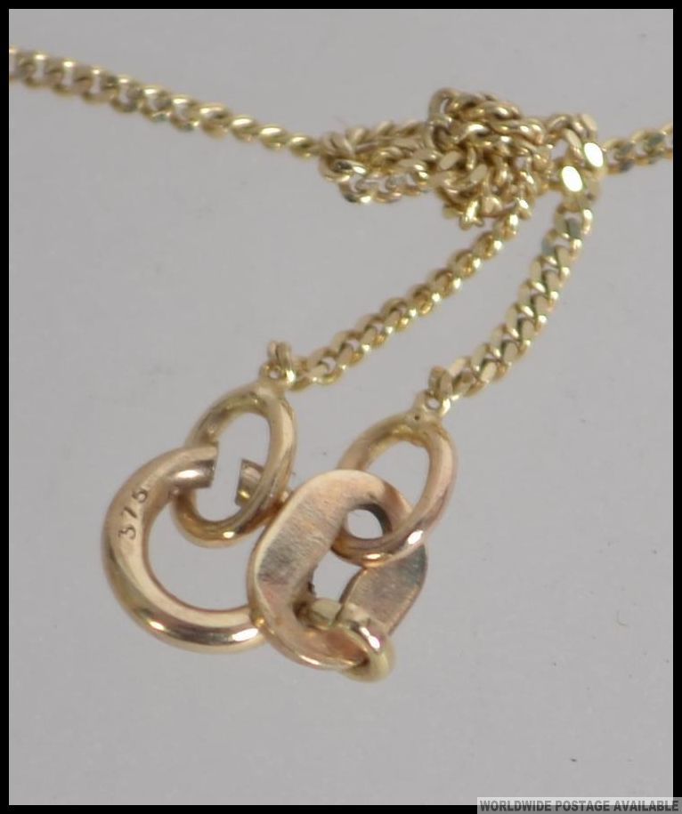 A ladies 9ct gold / 375 marked heart shaped pendant and fine necklace ...