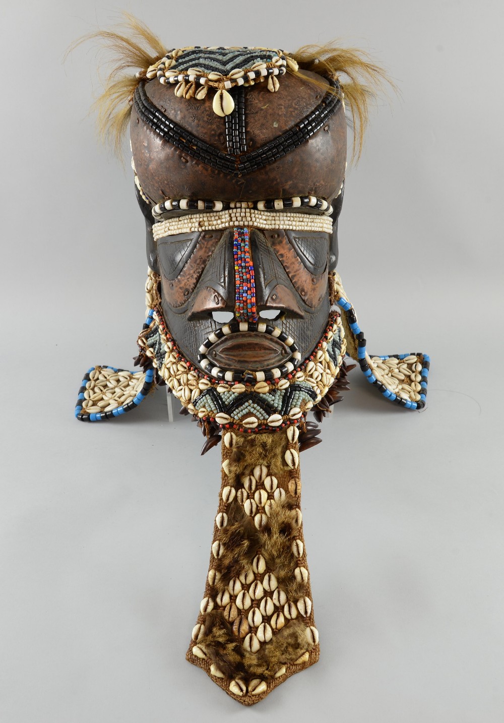 Mid to late 20th century African mask decorated with shells and beads ...