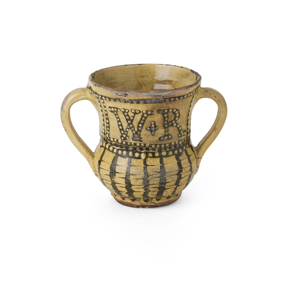 ENGLISH SLIPWARE LOVING CUP18TH CENTURYwith a flared rim and twin ...