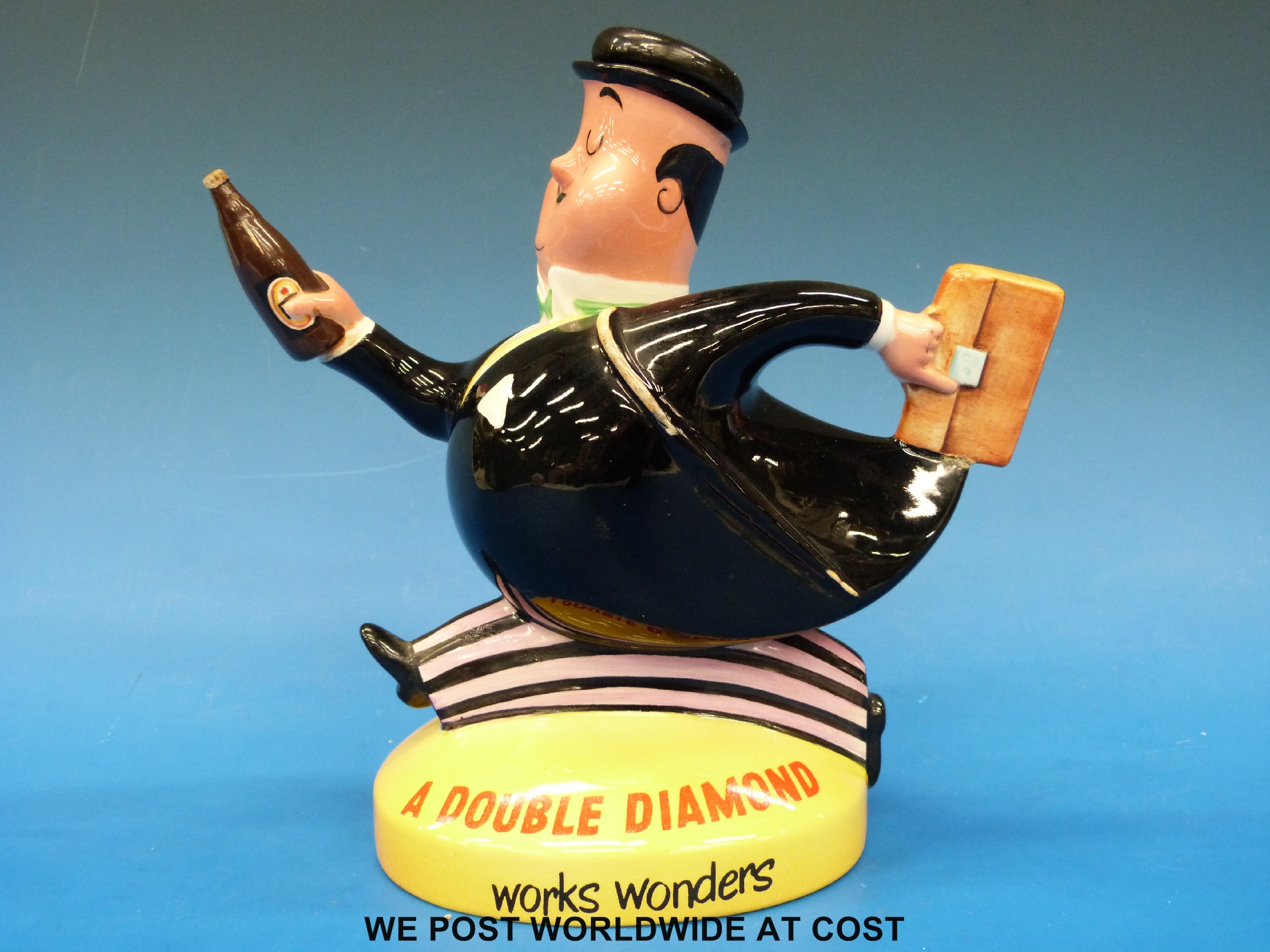 A Beswick Double Diamond running man figure