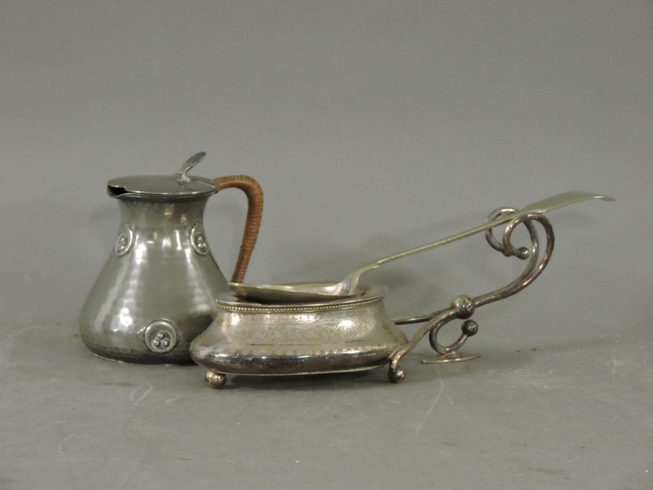An Art Nouveau pewter jug, stamped 'Connell, 83 Cheapside', 14cm high ...