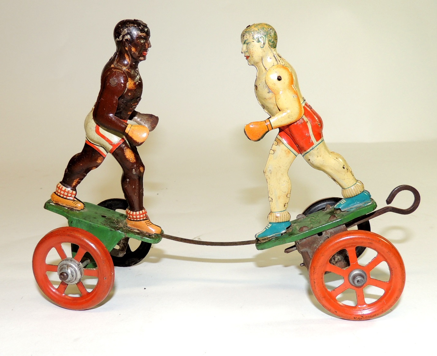 A German early 20th Century tinplate clockwork toy of two boxers ...