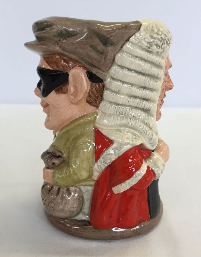 A Royal Doulton double sided Toby jug - The Judge and Thief.