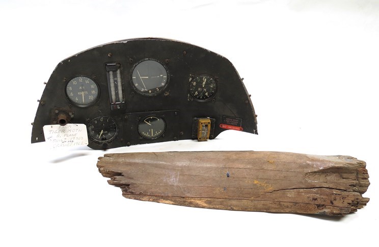 A WWII Tiger Moth instrument panel/dashboard with dials, together with ...