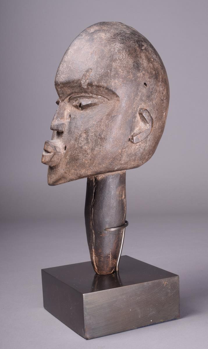 A Lobi head Burkina Faso with a medial ridge almond shape eyes and ...