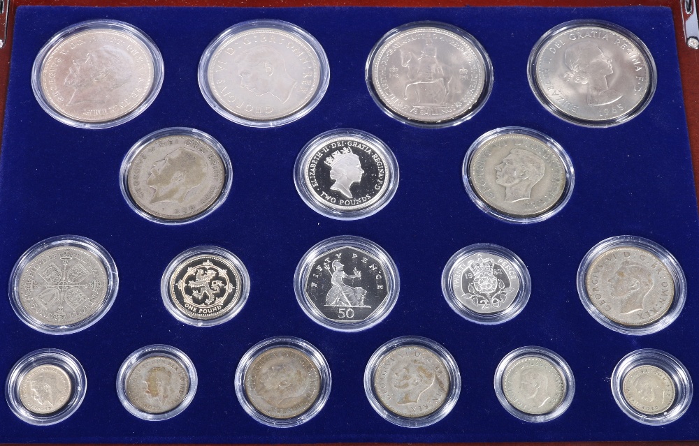 Danbury Mint House of Windsor silver coin collection in display cabinet