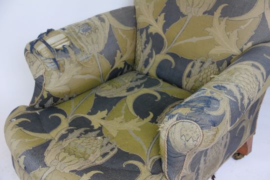 A late 19th century Irish club type chair by Strahan & Co, Dublin, of ...